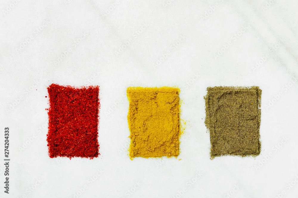 Variety of different ground spices in powder peppers paprika turmeric ...