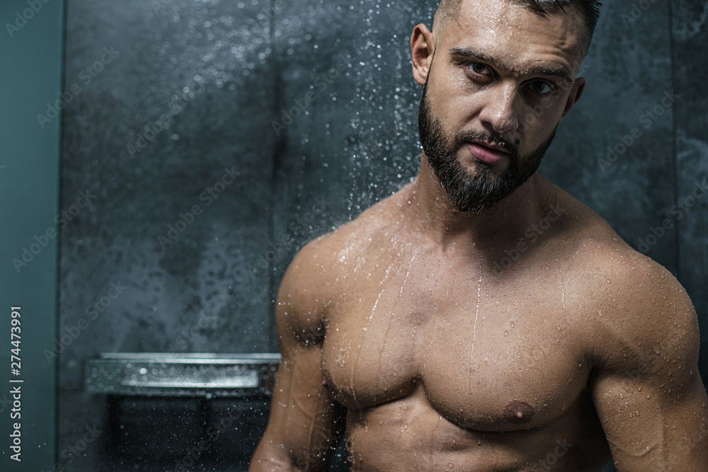 Sexy muscular man with naked torso in shower. Bodybuilder. Mature ...