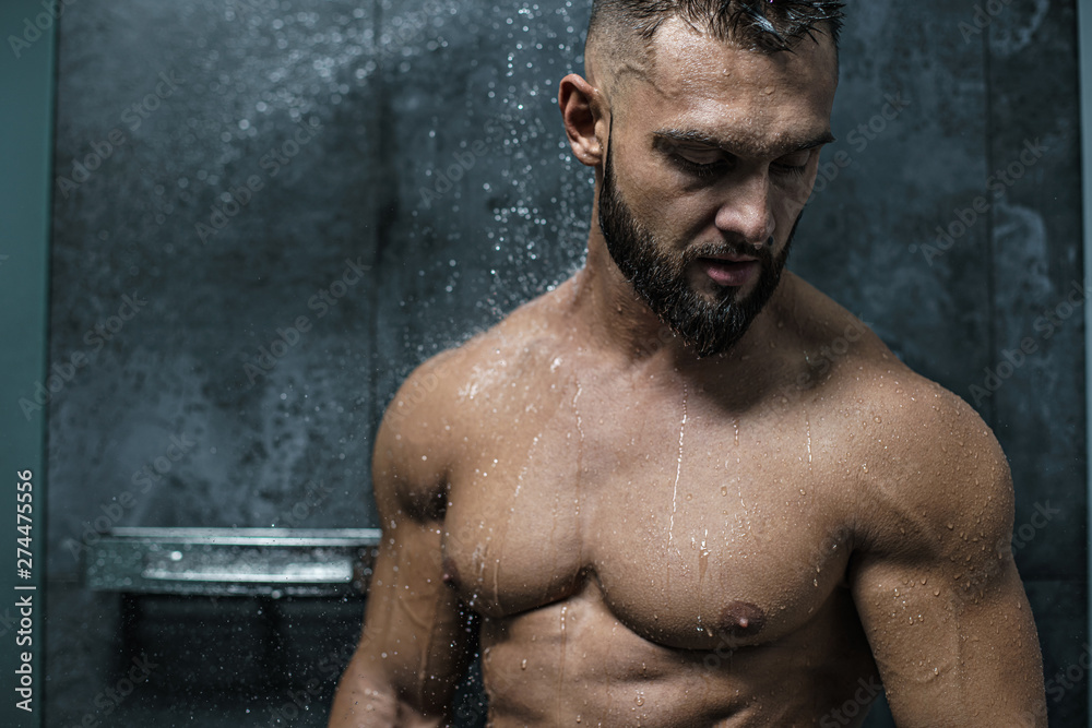Sexy muscular man with naked torso in shower. Bodybuilder. Mature ...