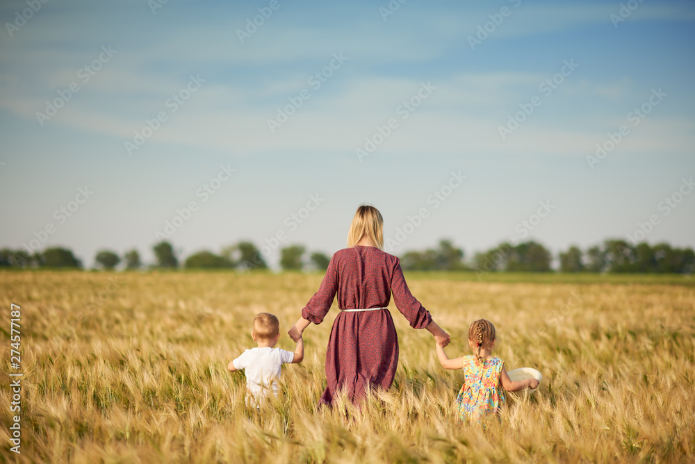 Family values. Happy mother and her children spending time together in ...