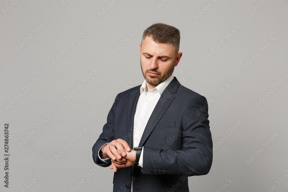 Handsome successful confident young business man in classic black suit ...