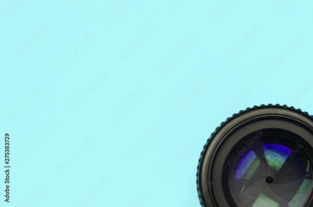 Camera lens with a closed aperture lie on texture background of fashion ...