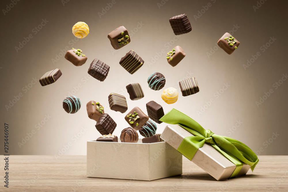 mix of chocolates jumping from gift box Stock Photo | Adobe Stock