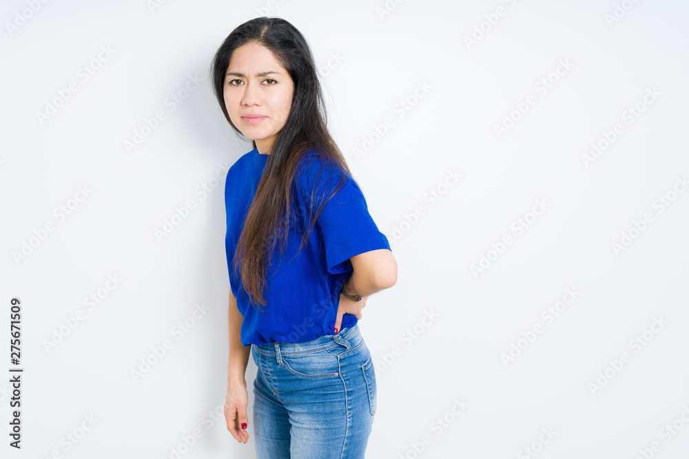 Beautiful brunette woman over isolated background Suffering of backache ...