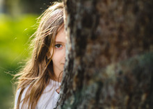 Young Girl Hiding Behind Tree Free Stock Photo - Public Domain Pictures