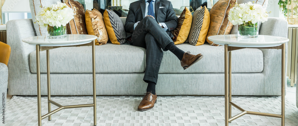 richness and success concept. business man sitting on a leather couch ...