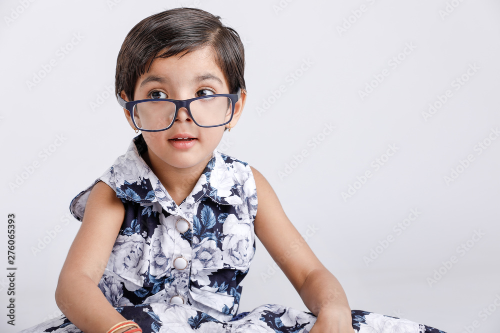 Cute indian little girl wearing spectacles Stock Photo | Adobe Stock