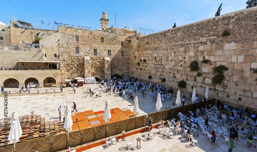 Praying people at the Wailing Wall. Visible division into two separate ...
