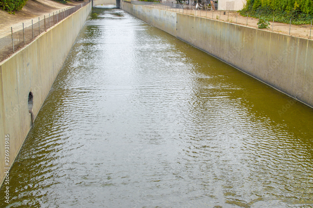 polluted river water flowing through a cement channel in Los Angeles ...