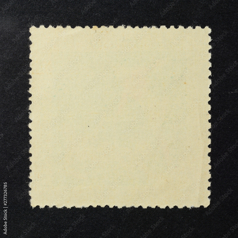 Blank vintage square postage stamp on black background. Mockup with ...