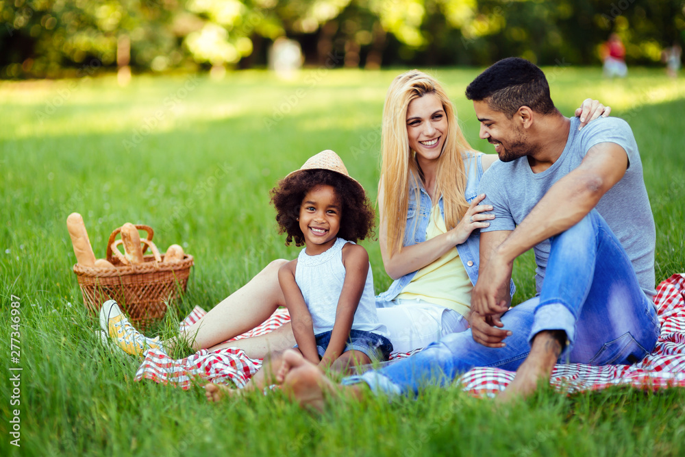 Picture of lovely couple with their daughter having picnic Stock Photo ...