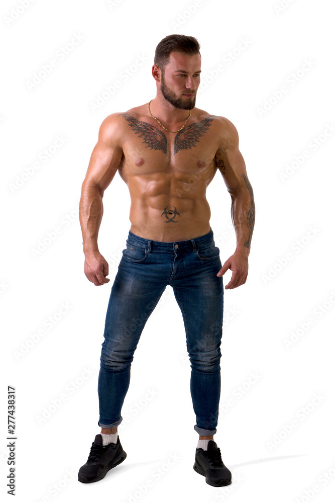 Full body shot of muscular man standing and looking to a side ...