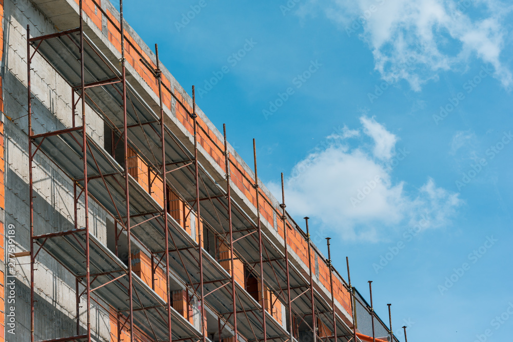 Scaffolding on empty construction site with unfinished incomplete ...