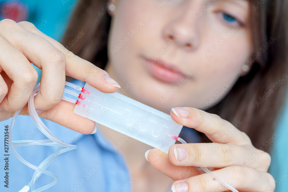 Girl holding polymers Bio-MEMS biomedical microelectromechanical ...