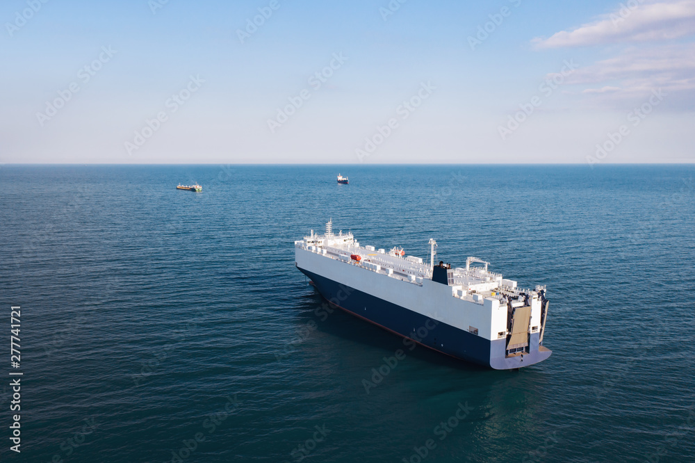 Aerial view of high-speed sea vessel for transportation of cargo vessel ...