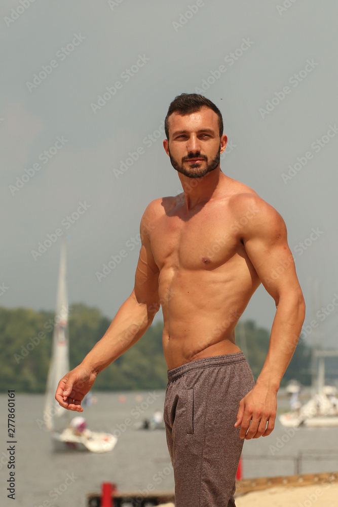 Stock-Foto „beach, sand, resort, fitness, sexy, gym, body, chest, relax, hotel, bodybuilder, abs ...