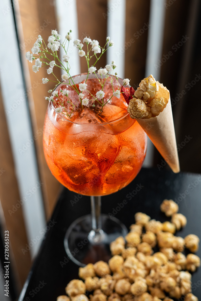 Sparkling light alcoholic cocktail with caramel popcorn, based on ...