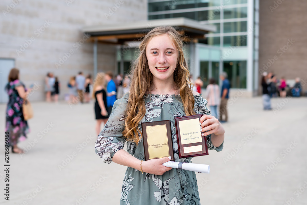 Young Teen Girl/Middle School student standing in front of school with ...