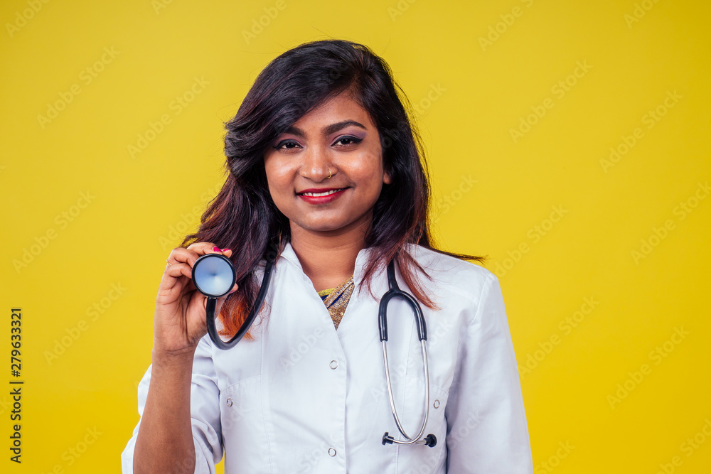 Female indian young and beautiful blond woman gynecologist doctor using ...