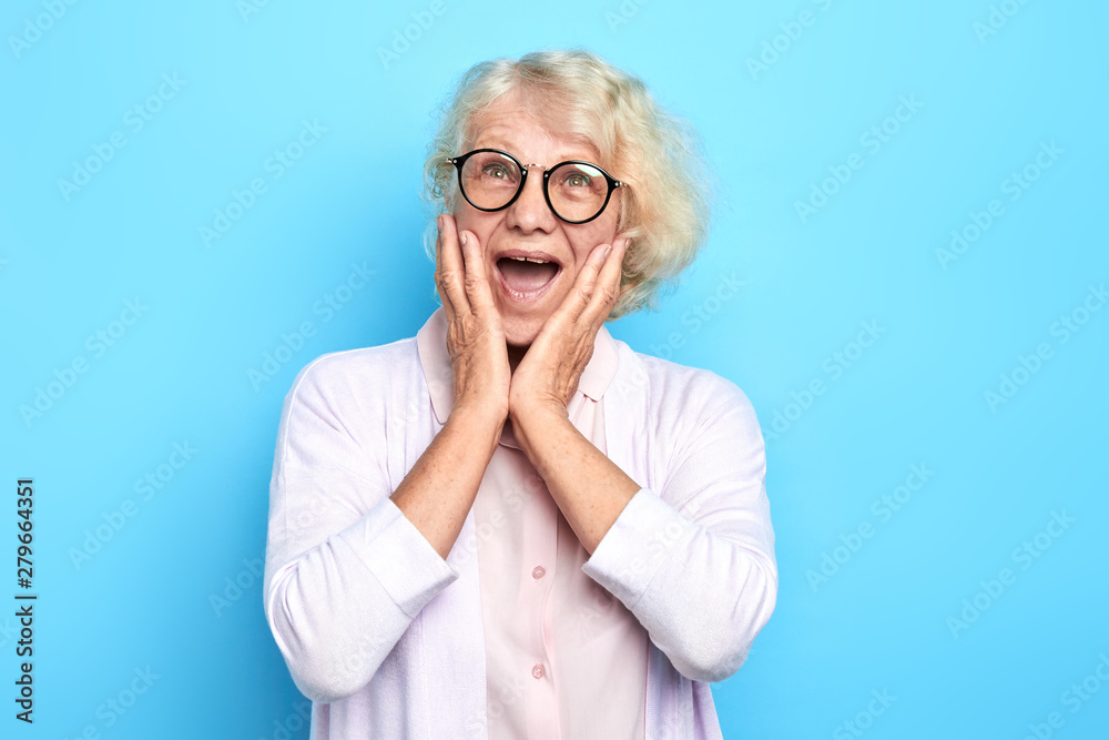 senior emotional doctor woman terrified with fear, shouting in shock ...