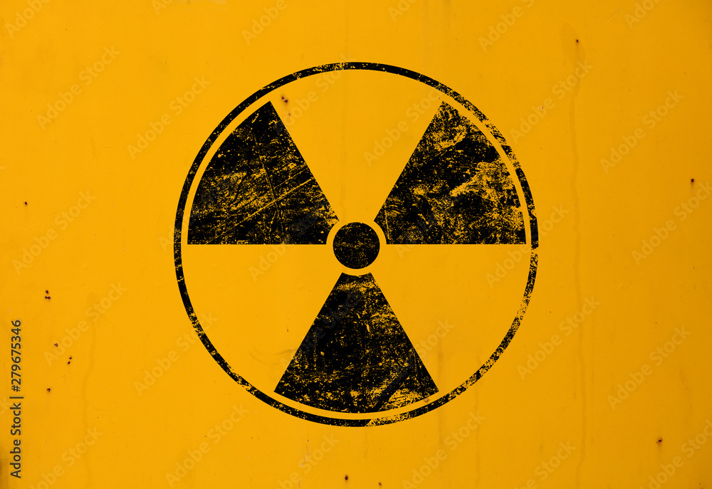 Black radioactive sign over yellow background Stock Photo | Adobe Stock