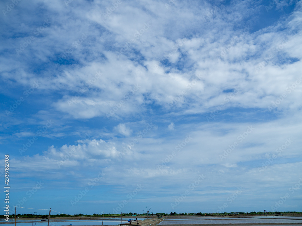 Sea salt fields local farm industry on a beautiful blue sky in Thailand ...