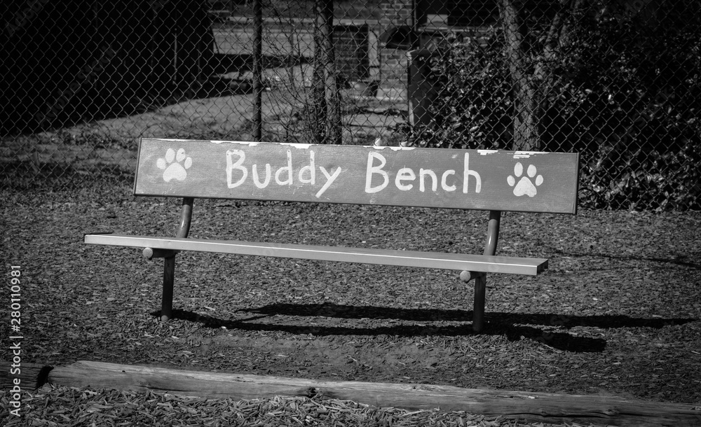 A bench at a elementary school playground for a lonely child to sit on ...