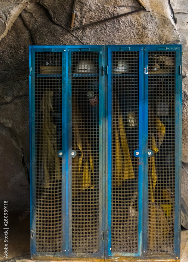 historical miner lockers with work outfits, Nostalgic work equipment ...