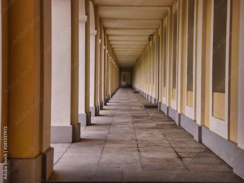 Leaving the terrace of the palace. Open corridor with stone slabs on ...
