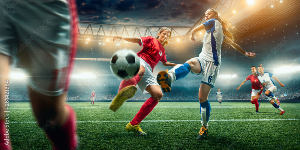 Female Soccer players performs an action play on a professional soccer ...