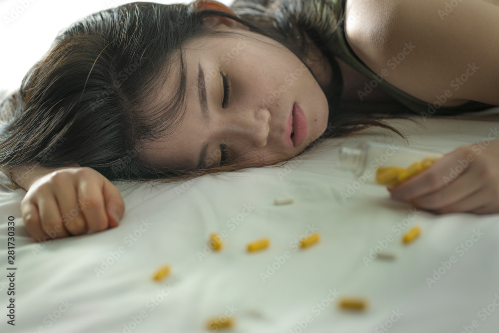 young beautiful desperate and wasted addict Asian Japanese woman taking ...