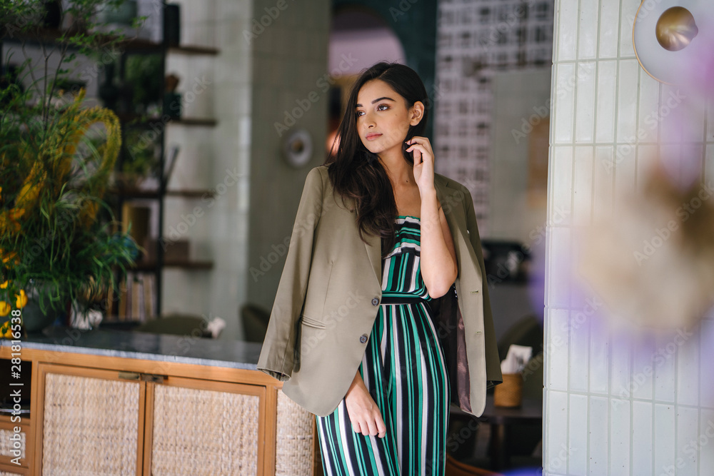 Portrait of a tall, slim, elegant and beautiful Indian Asian woman in ...