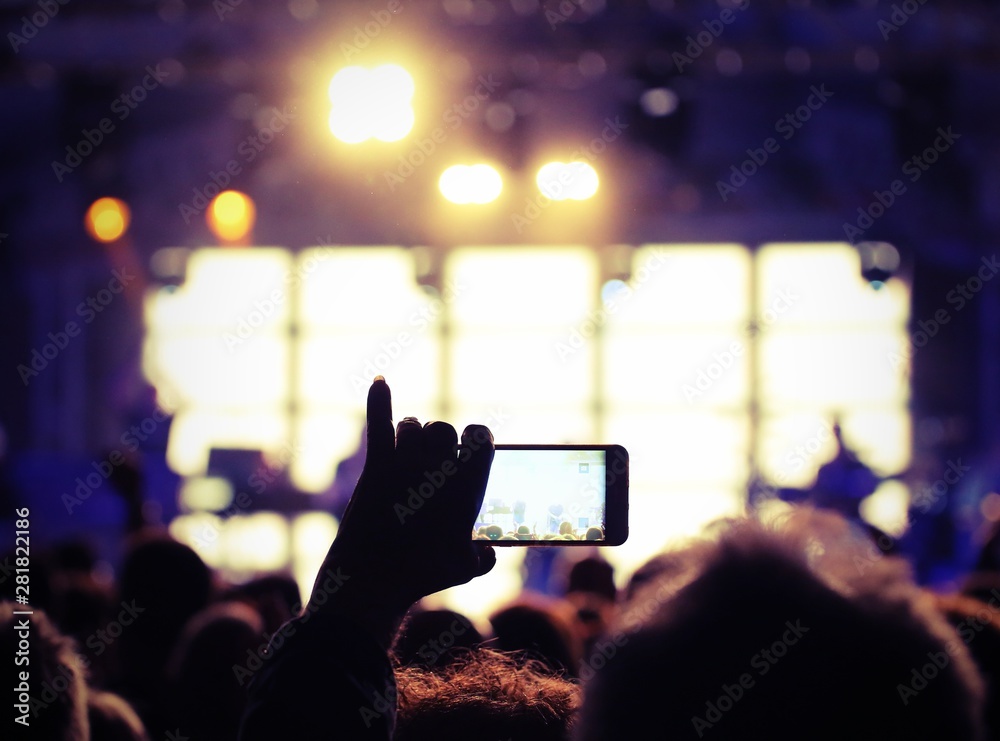 viewer photographs with the cell phone the the singer who perfo Stock ...