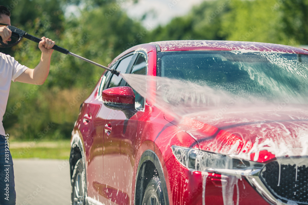 Manual car wash with pressurized water in car wash outside. Summer Car ...