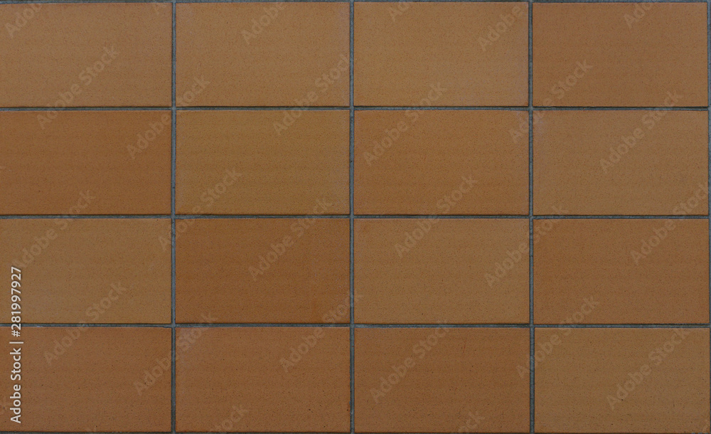Texture of a wall build with big brown tiles Stock Photo | Adobe Stock