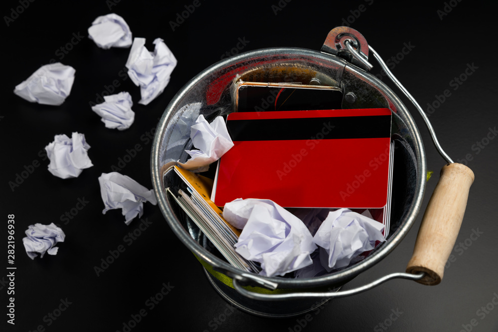 Credit/debit/shopping cards and crumpled paper are in the rubbish bin ...