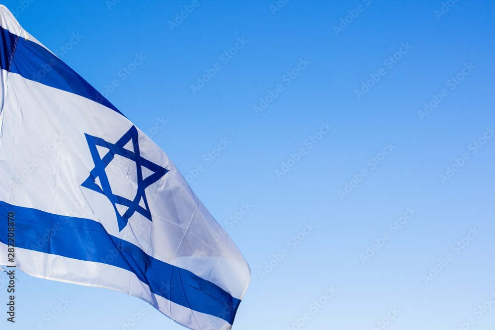 Israeli white and blue national flag with star of David evolving on a ...
