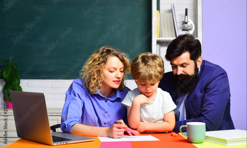 Mathematics for kids. Cute pupil and his father and mother making ...