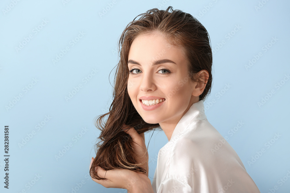 Beautiful young woman after washing hair against color background Stock ...