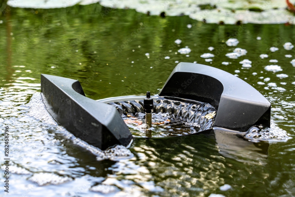 Water around skimmer boils from air bubbles. Very close-up. Skimmer ...