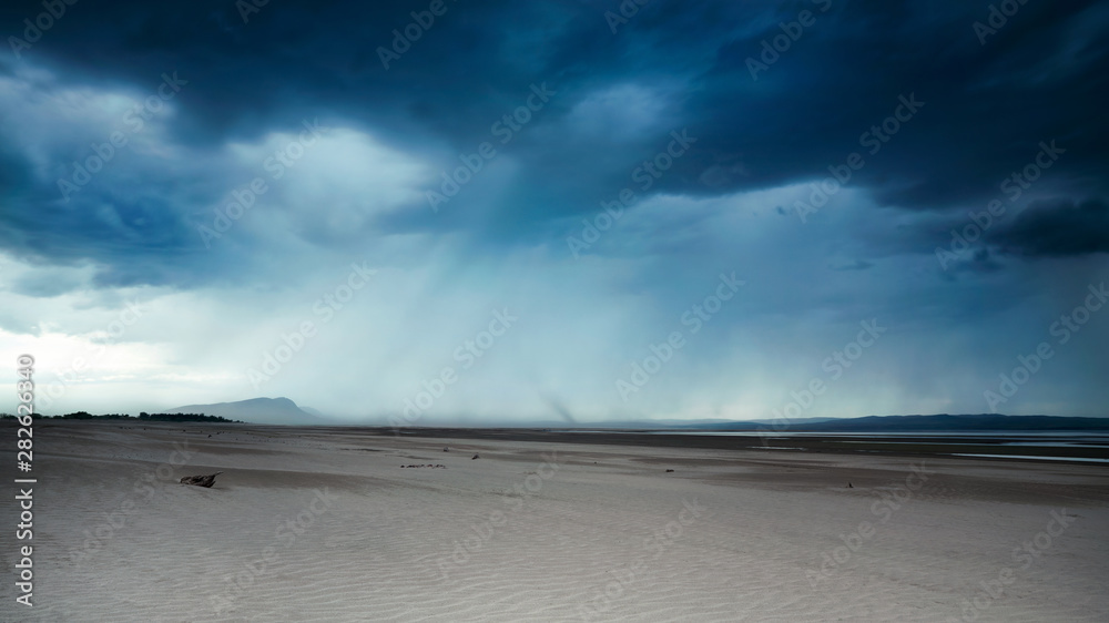 Sandy beach before the storm, it is raining and thunderclouds Stock ...