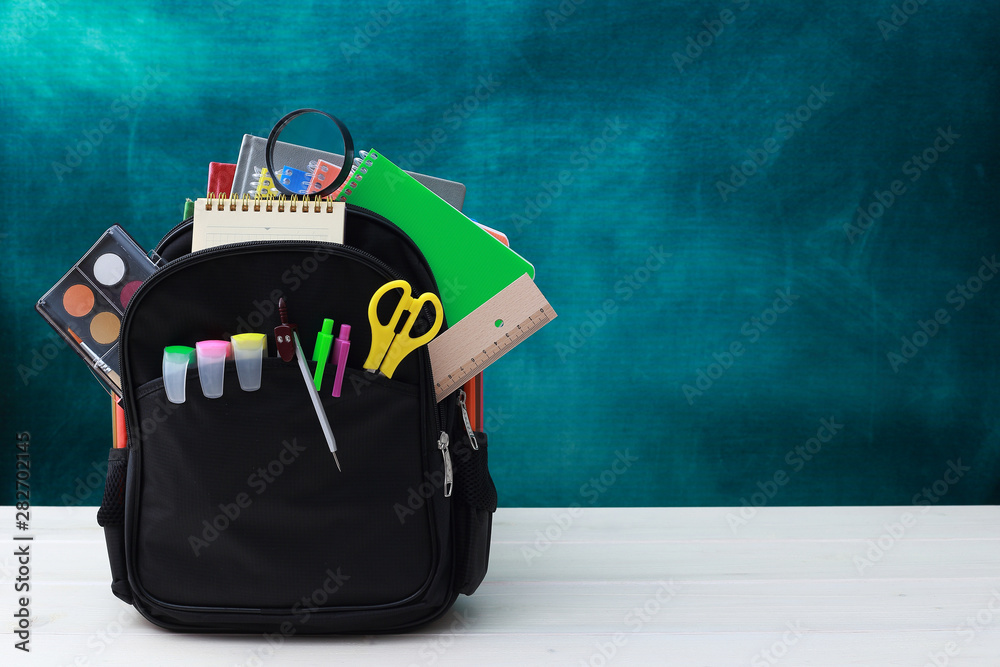 Back to school concept. School bag, pencils, crayons, scissor ...