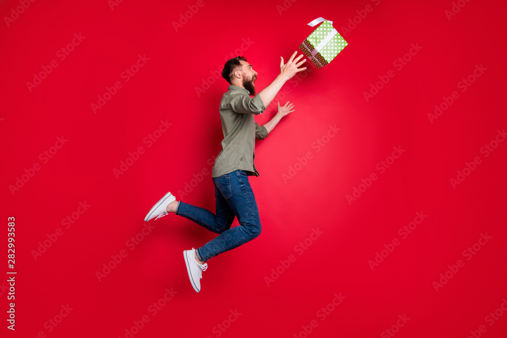 Full length body size photo of man trying to catch his prize gift while ...