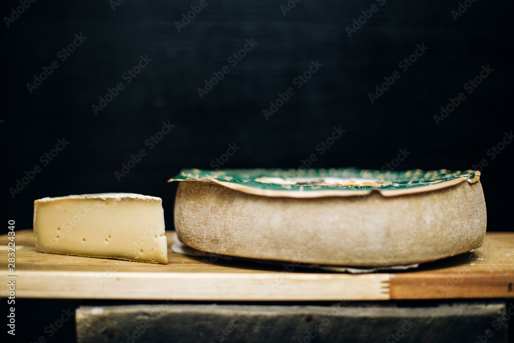 Detail of Raclette de Montagne cheese. Raclette is a semi-hard cheese ...