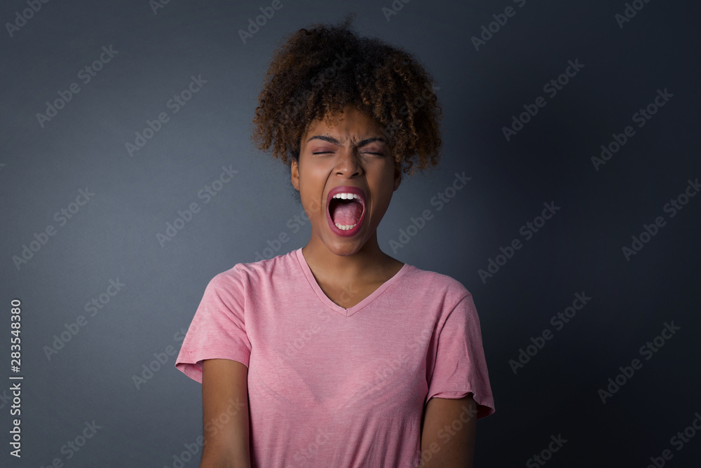 Stressful African American woman screams in panic, closes eyes in ...