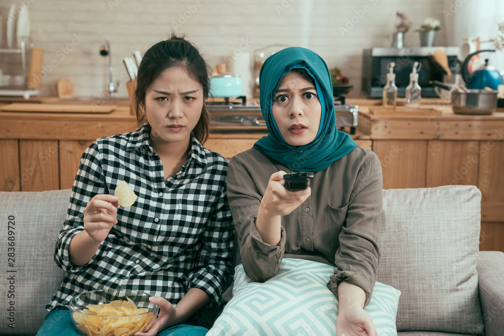 Concept of human reactions. Group of female friends sit on sofa in ...