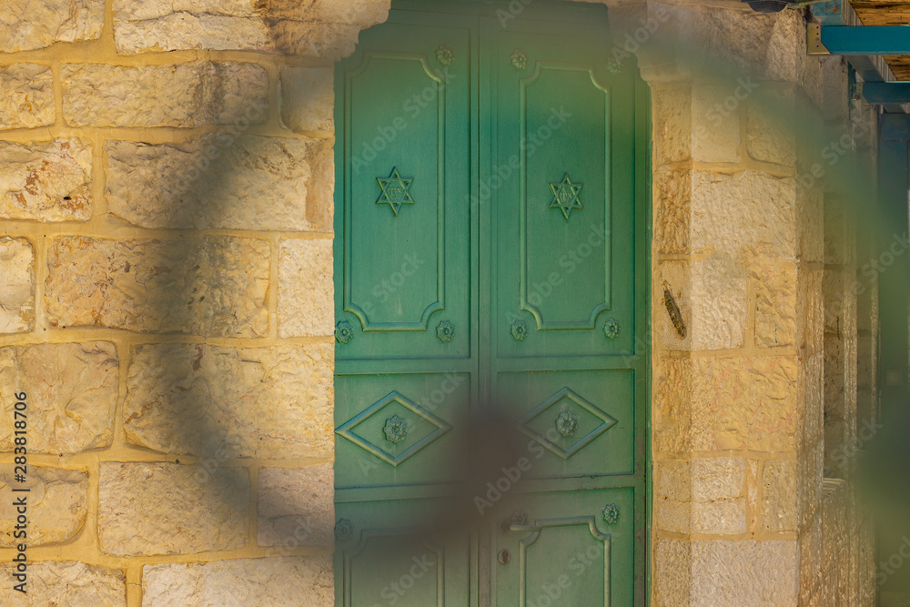 Jewish synagogue entrance door and stone wall exterior facade ...