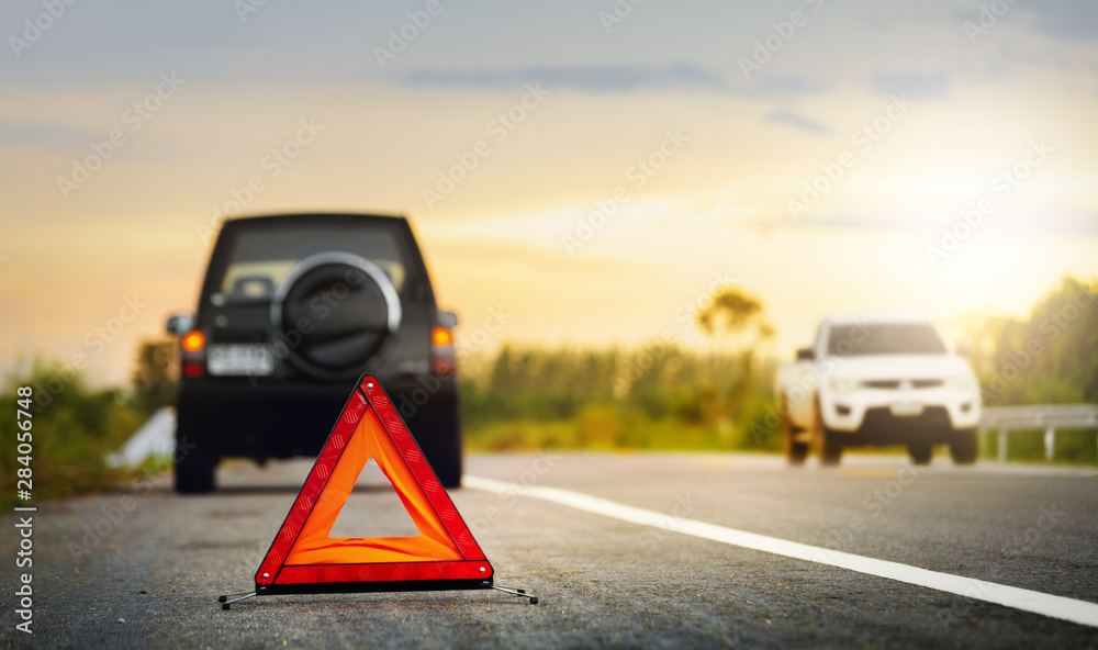 Red emergency stop sign (red triangle warning sign) and broken black ...