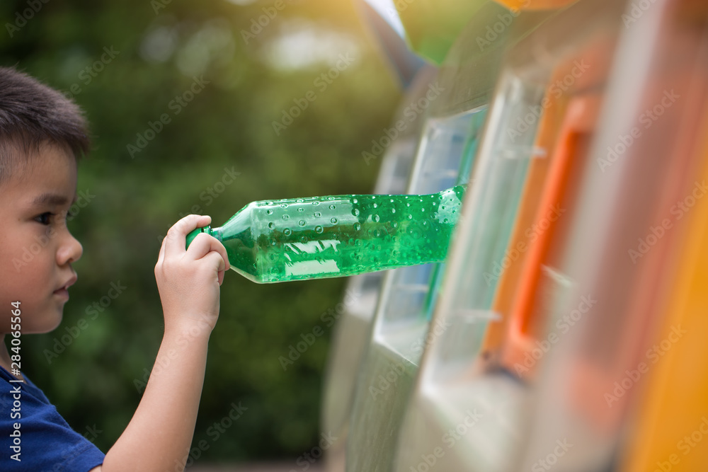 Close up hand throwing empty plastic bottle into the trash, recycling concept Stock Photo ...