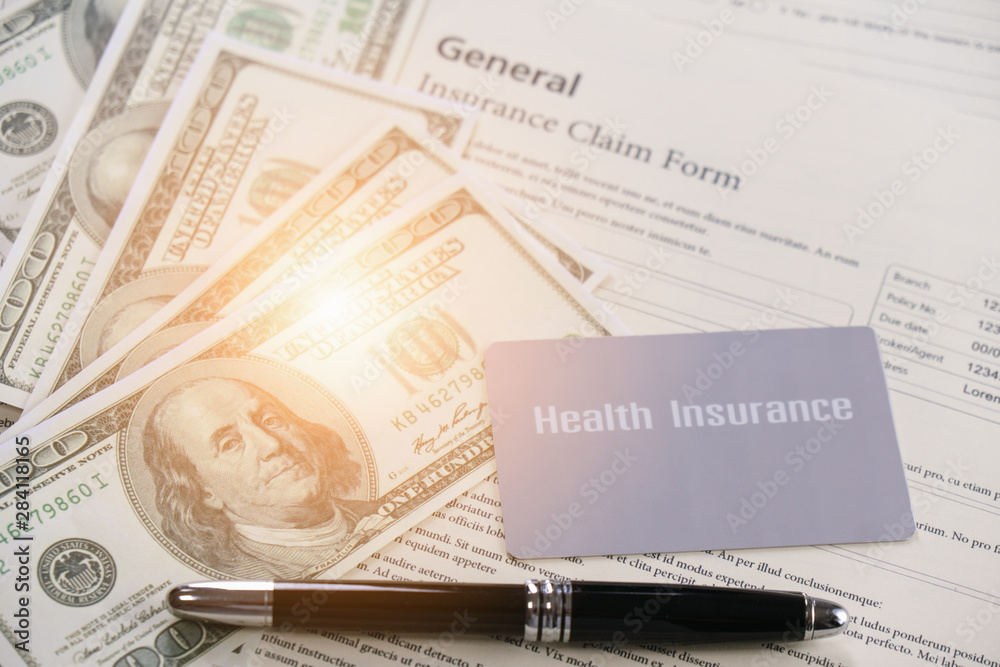 health insurance card and bank note and pen on background of general ...
